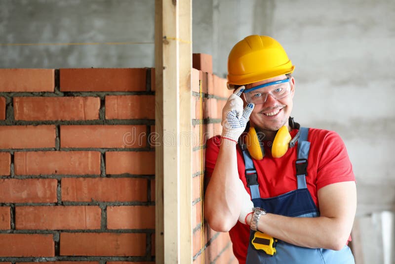 The Builder Stands on a Suspended Platform and Insulates the Facade of ...