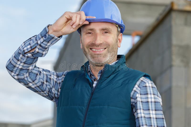 Happy Builder Worker at Construction Site Stock Photo - Image of helmet ...