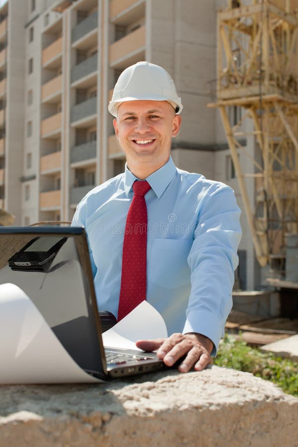 Happy Builder Works on the Building Site Stock Image - Image of laptop ...
