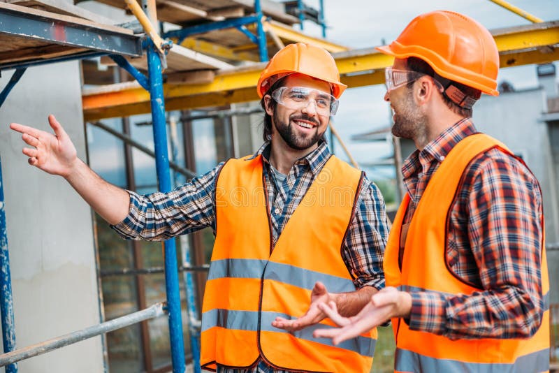 Happy Builders in Hardhats with Tablet Pc Outdoors Stock Image - Image ...