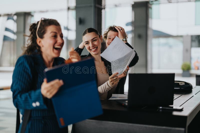Happy Business Colleagues Celebrating Success with Documents in Office ...