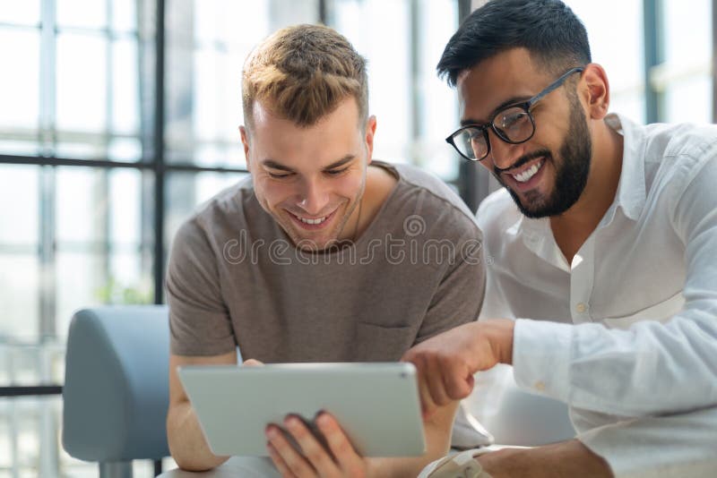 Happy Business Colleagues in Modern Office Using Tablet Stock Image ...