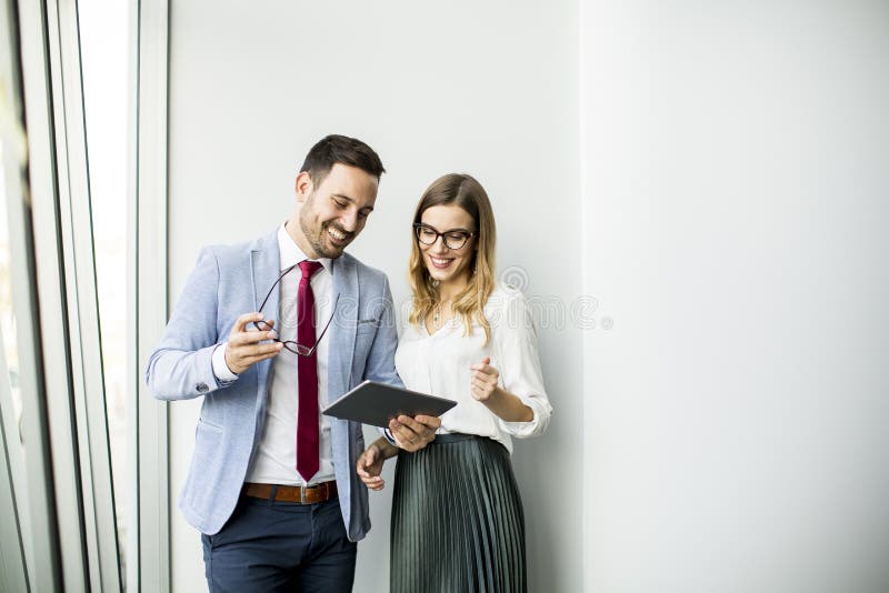 Happy Business Colleagues in Modern Office Using Tablet Stock Photo ...