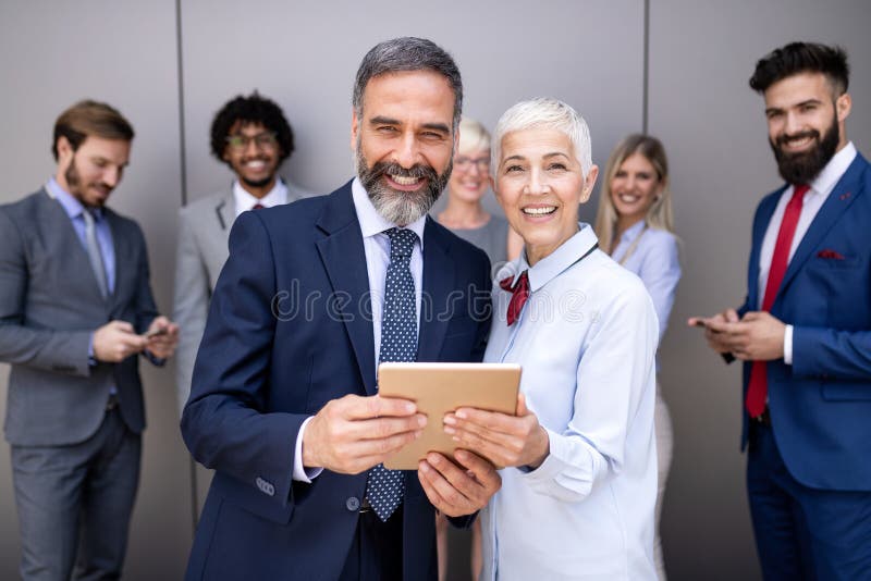 Happy Business Colleagues in Modern Office Using Tablet Stock Photo ...