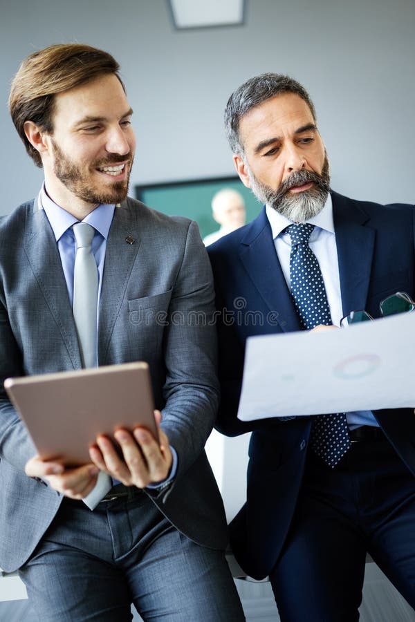 Happy Business Colleagues in Modern Office Using Tablet Stock Photo ...