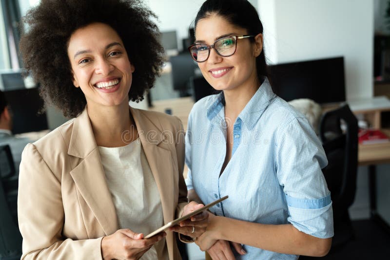 Happy Business Colleagues in Modern Office Using Tablet Stock Photo ...