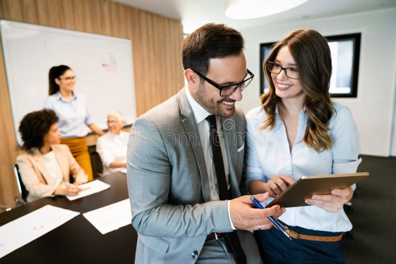 Happy Business Colleagues in Modern Office Using Tablet Stock Photo ...