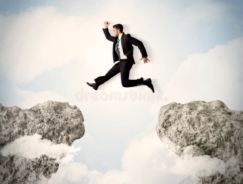 Happy Business Man Jumping Over a Cliff Stock Photo - Image of ...