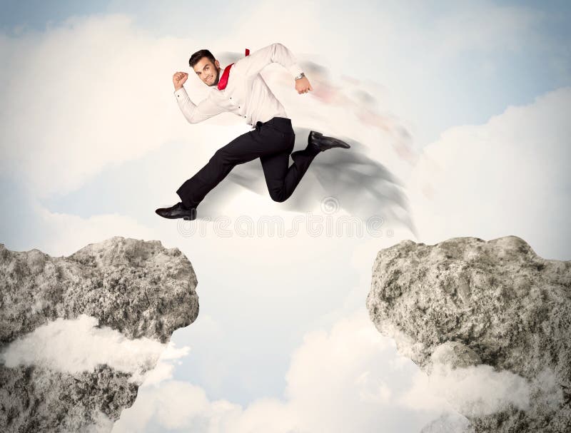 Happy Business Man Jumping Over a Cliff Stock Photo - Image of ...
