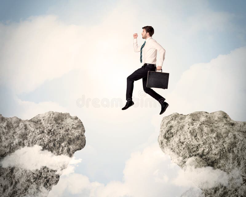 Happy Business Man Jumping Over a Cliff Stock Photo - Image of ...