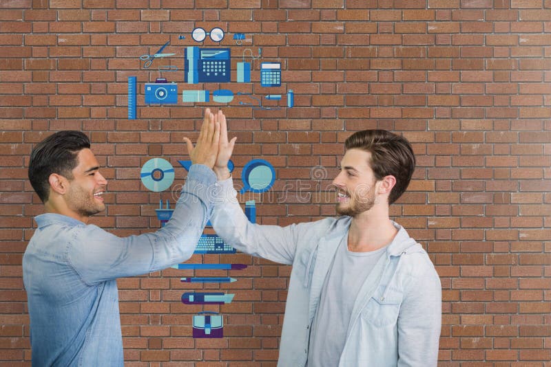 Happy Business Men Doing a High Five Against Brick Wall with Graphics ...