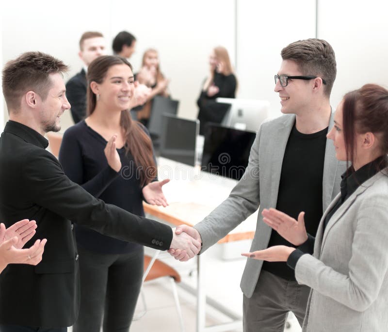 Happy Business Partners Confirming the Transaction with a Handshake ...