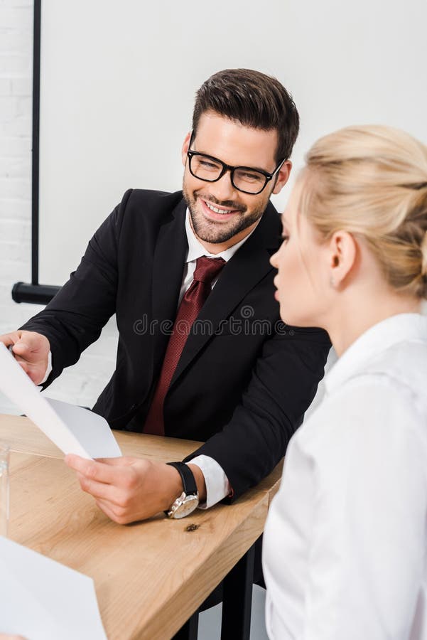 Happy Business Partners Discussing Papers Stock Photo - Image of work ...