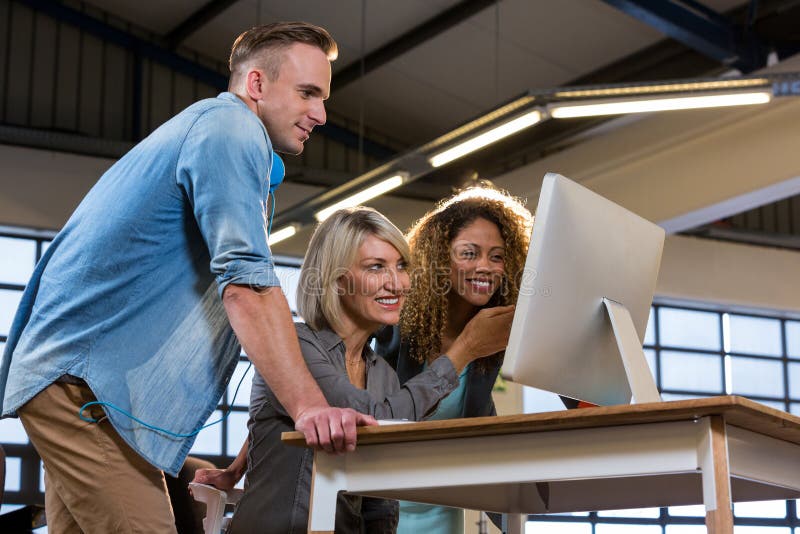 Happy Business People Discussing Over Computer Stock Photo - Image of ...