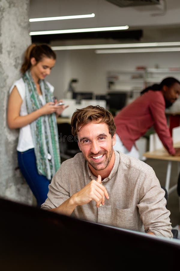 Happy Business People Having Fun and Chatting at Workplace Office Stock ...