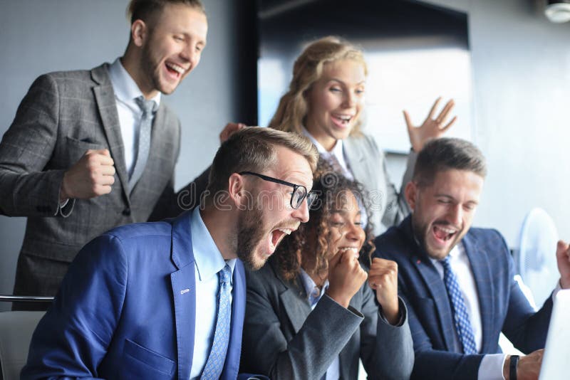 Happy Business People Laugh Near Laptop In The Office Successful Team