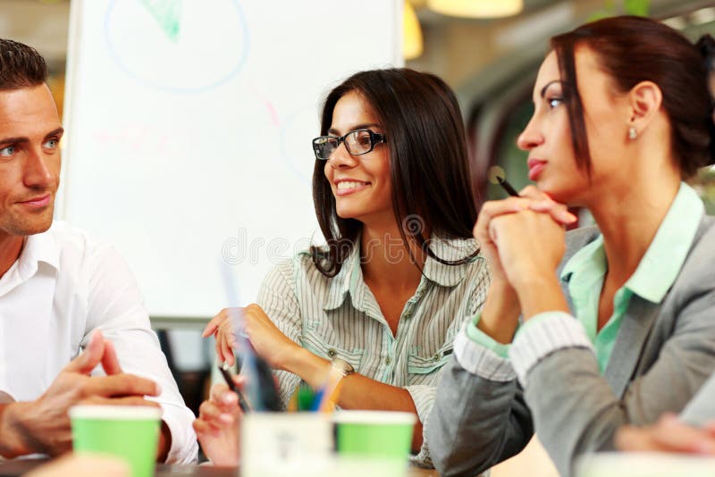 Happy Business People Sitting Around the Table Stock Photo - Image of ...