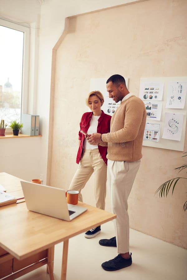 Happy Business People Using Smartphone. Smiling Colleagues Talking ...