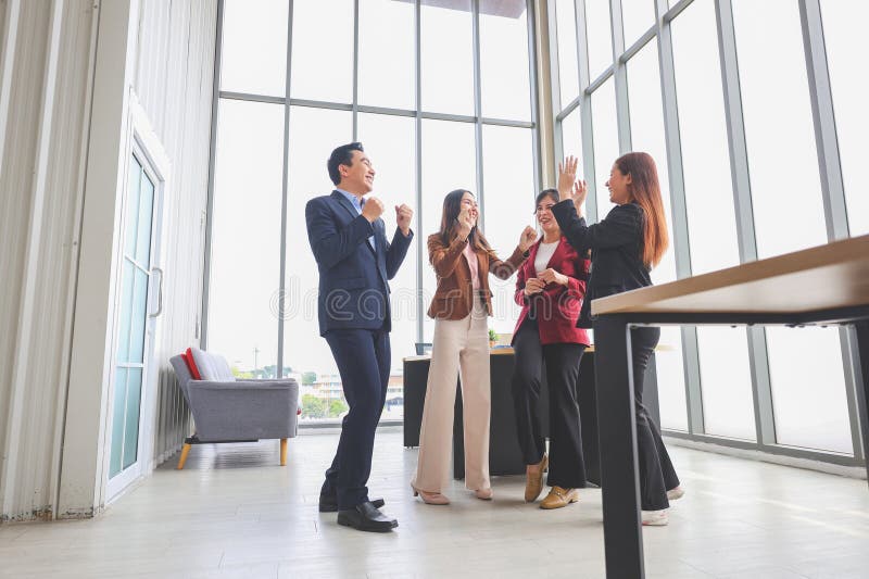 Happy Business Team Celebrating Success in Modern Office Stock Photo ...