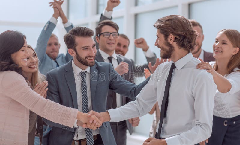 Happy Business Team Congratulating Young Business Partners Stock Photo ...