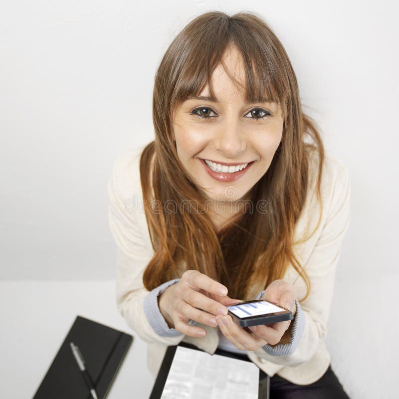Happy Business Woman Using a Smart Phone and Digital Tablet Stock Photo ...
