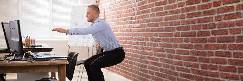 Businessman Doing Exercise in Office Stock Photo - Image of boss ...