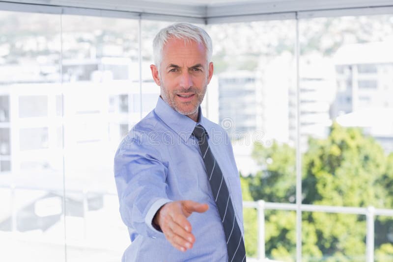 Man Extending Arm for a Handshake Stock Photo - Image of contact ...