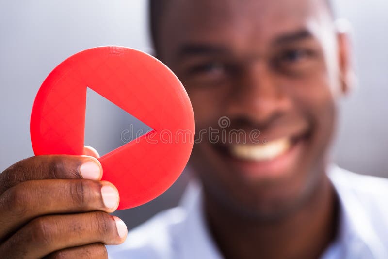 Happy Businessman Holding Red Play Button Stock Photo - Image of ...