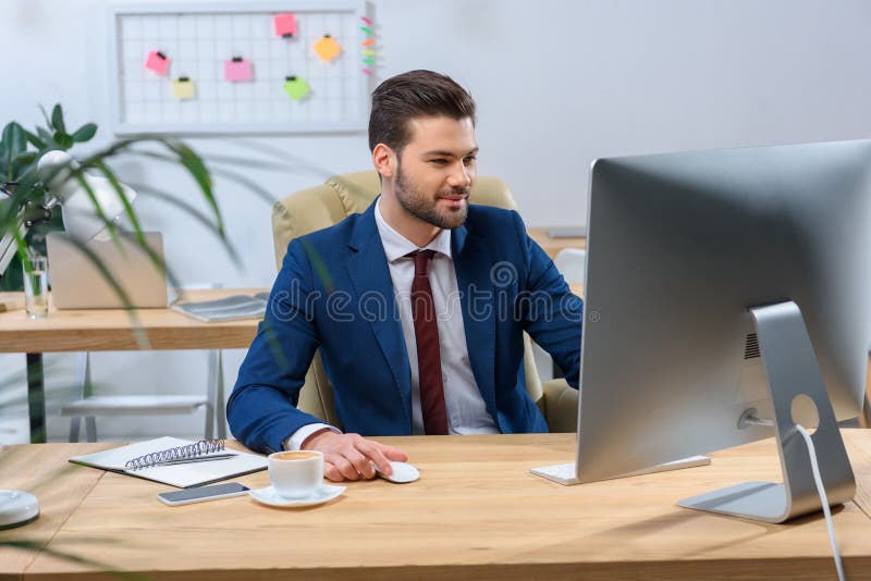Happy Businessman Looking at Computer Stock Photo - Image of focus ...