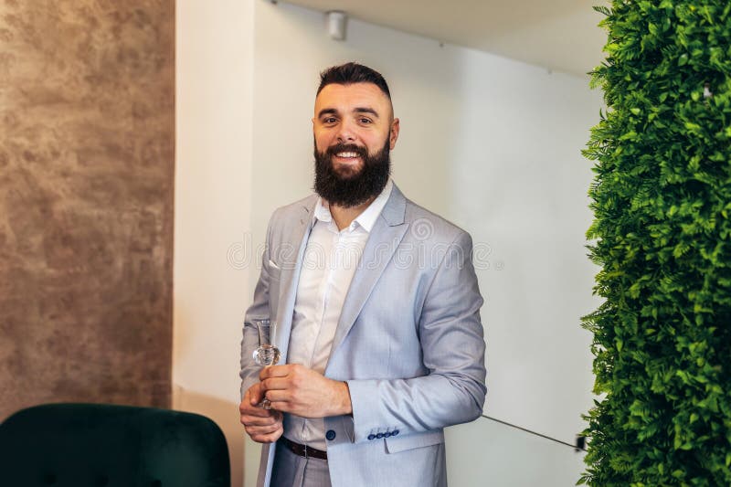 Businessman in the Office Lobby Drinking a Drink after Work Stock Image ...