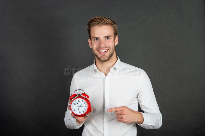 Happy Businessman Pointing Finger at Clock. Time Management Stock Image ...