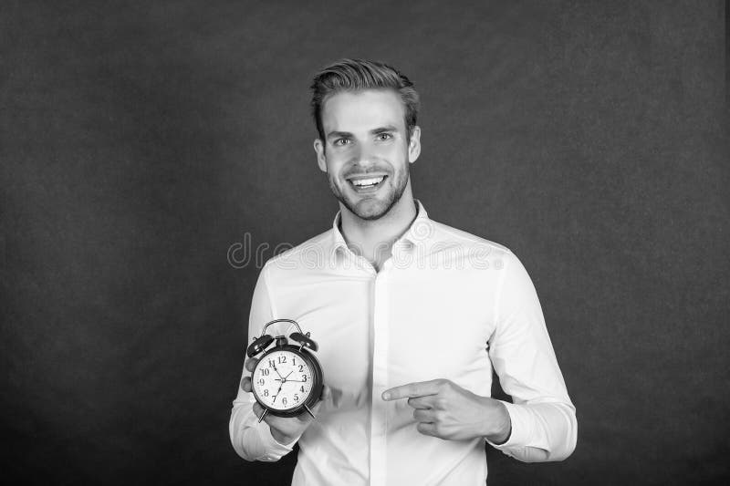 Happy Businessman Pointing Finger at Clock. Time Management Stock Photo ...