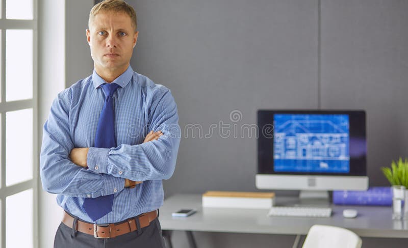 Happy Businessman Standing Behind Office Desk, Smiling Stock Image ...