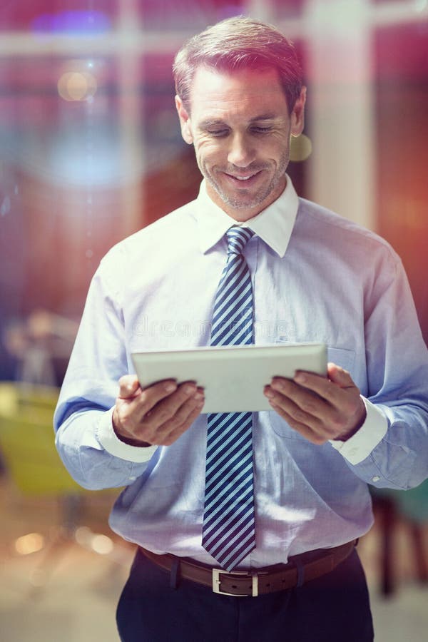 Happy Businessman Using Digital Tablet Stock Photo - Image of ... Happy Businessman Using Digital Tablet Stock Photo - Image of ...