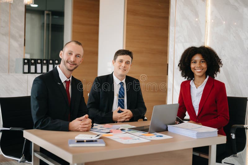Happy Businesspeople while Collaborating on a New Project in an Office ...
