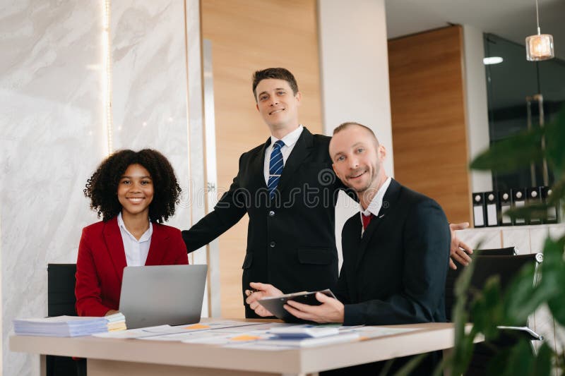 Happy Businesspeople while Collaborating on a New Project in an Office ...