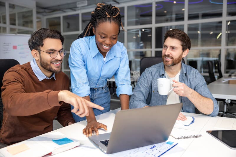 Happy Businesspeople Collaborating on New Project in Office Stock Image ...