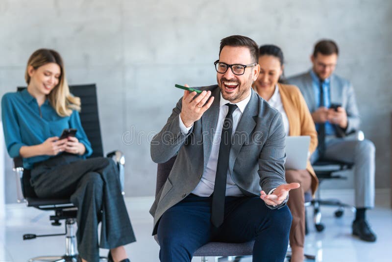 Happy Businesspeople Laughing while Collaborating on a New Project in ...
