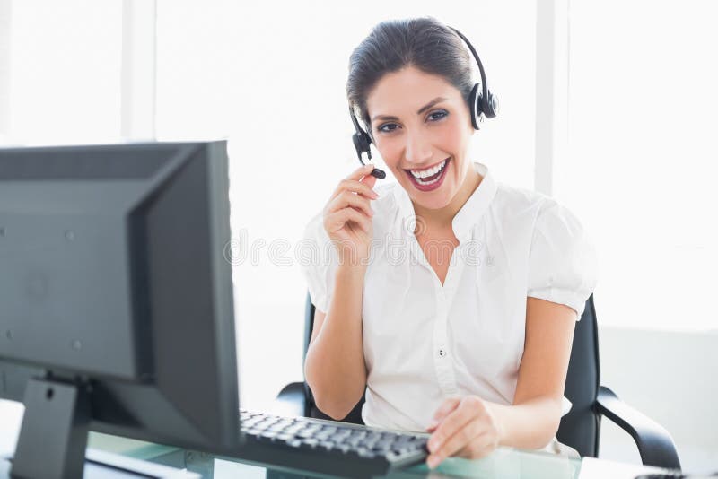 Happy Call Centre Agent Sitting at Her Desk on a Call Stock Image ...