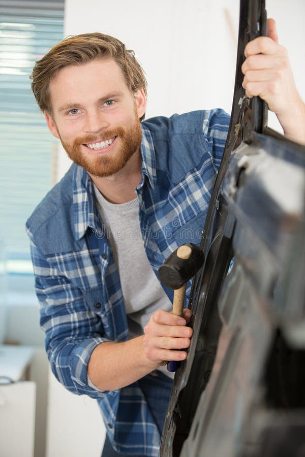Happy car body-shop worker stock photo. Image of preparation - 309076144