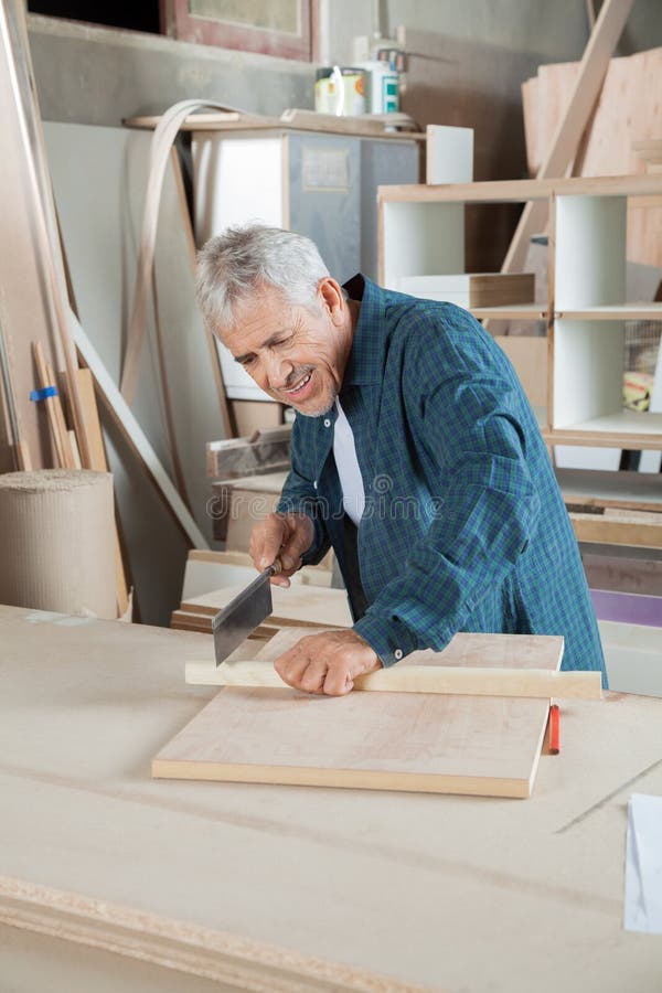 Happy Carpenter Cutting Wood with Small Saw Stock Photo - Image of ...