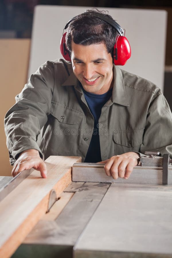 Happy Carpenter Cutting Wooden Plank with Tablesaw Stock Photo - Image ...