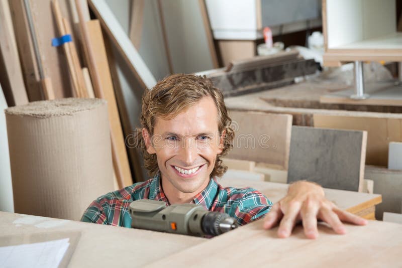 Happy Carpenter Drilling Wood in Workshop Stock Photo - Image of ...