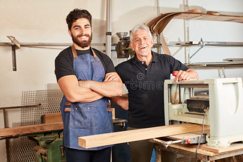 Carpenter Team Works on a Planing Machine Stock Photo - Image of ...
