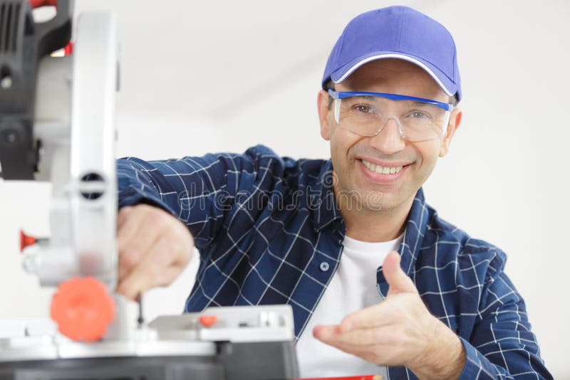 Happy Carpenter Working on Electric Buzz Saw Stock Photo - Image of ...