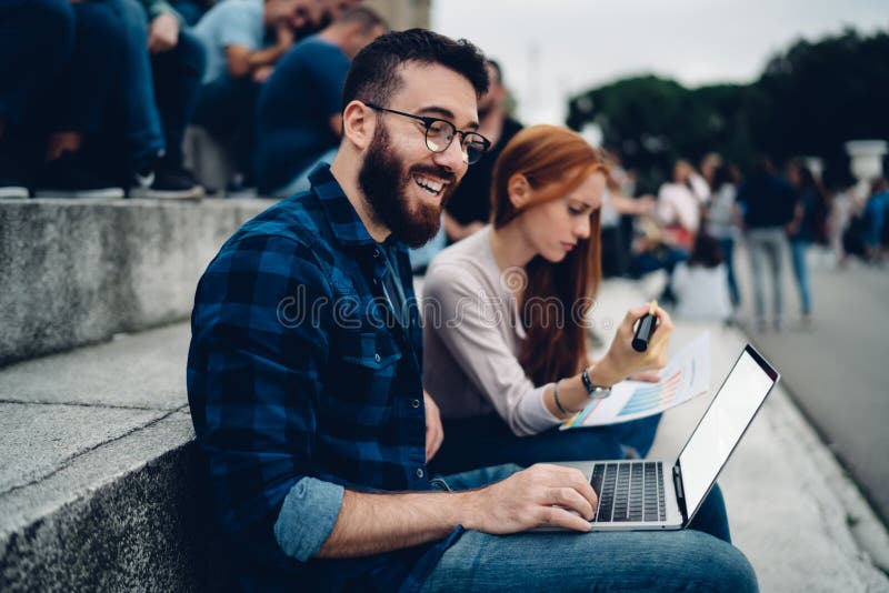 Happy Caucaisan Programmer in Spectacles Using Netbook for Media ...