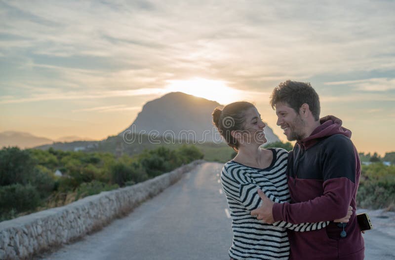 Happy Caucasian Couple Under a Sunset Sky Stock Image - Image of ...