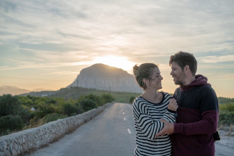 Happy Caucasian Couple Under a Sunset Sky Stock Photo - Image of ...