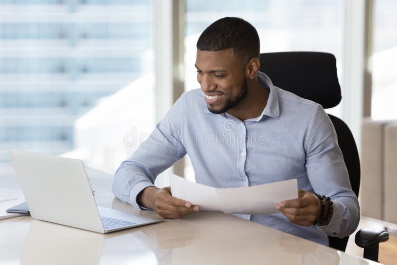 Happy Cheerful African Employee Man Holding Documents at Work Table ...