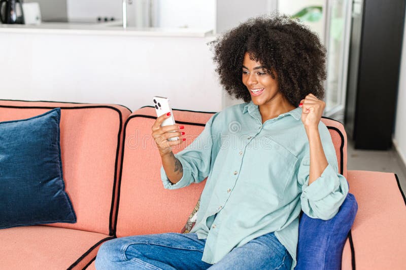 Happy Cheerful Attractive African American Woman Celebrating Success